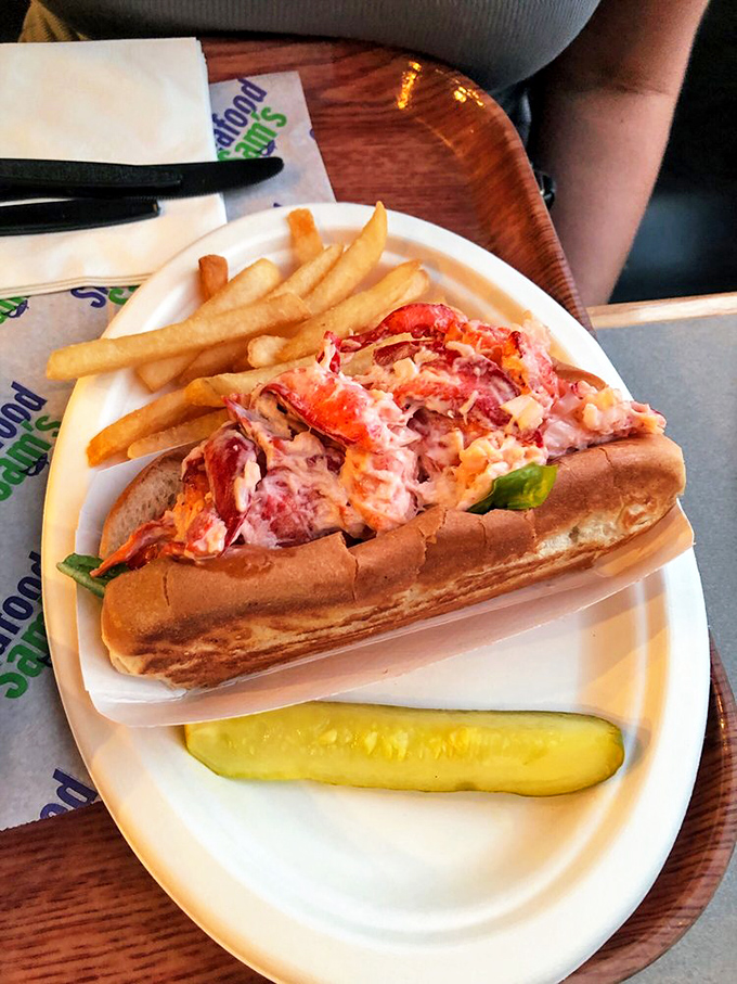 The star of the show: a lobster roll bursting with sweet meat, barely dressed and nestled in a perfectly toasted bun. Summer on a plate.