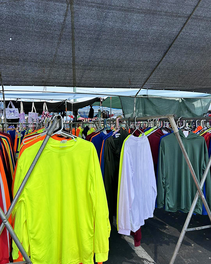 A rainbow of long-sleeve shirts awaits new owners, from high-visibility neon to subtle earth tones. Fashion treasure hunting at its finest!