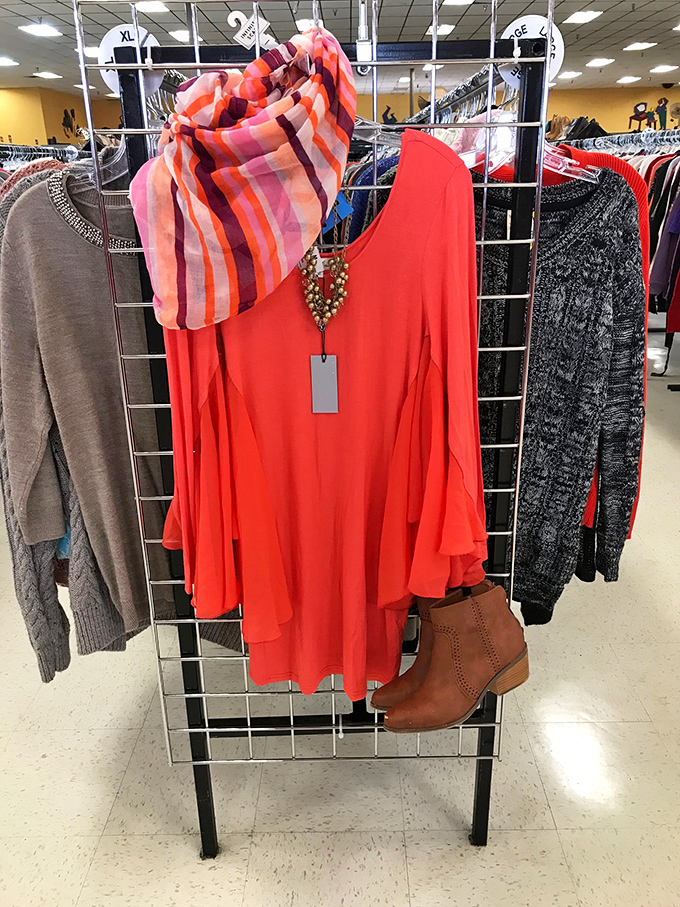This outfit curation could grace a boutique window at five times the price. The coral top practically radiates vacation vibes.