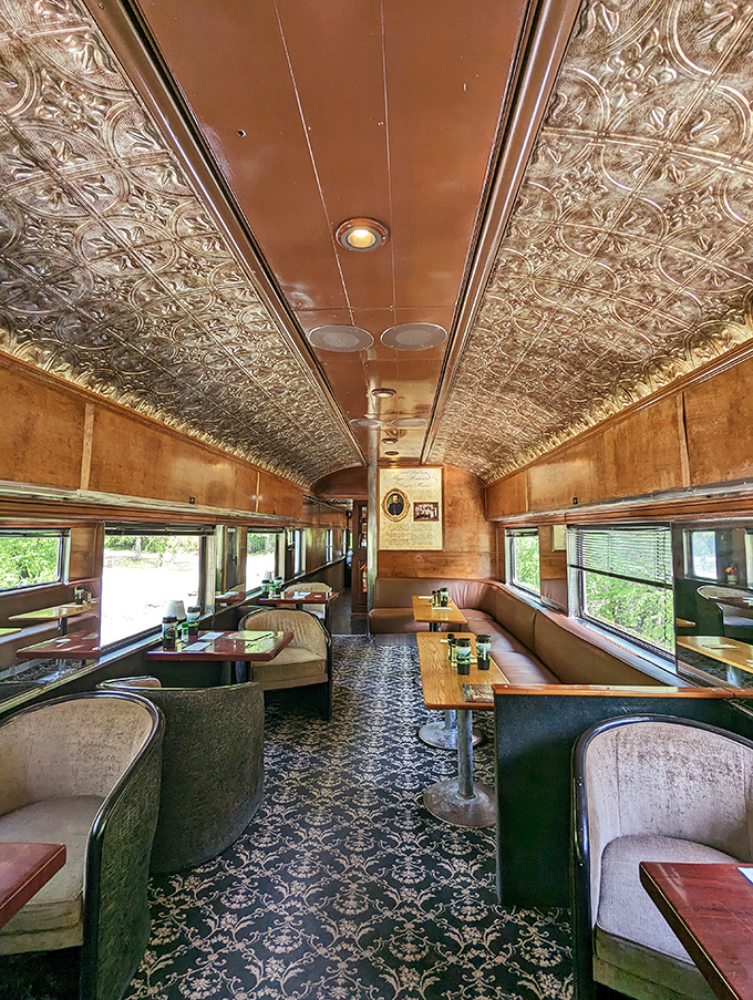 The ornate tin ceiling and plush seating create an atmosphere fancier than most people's dining rooms back home.