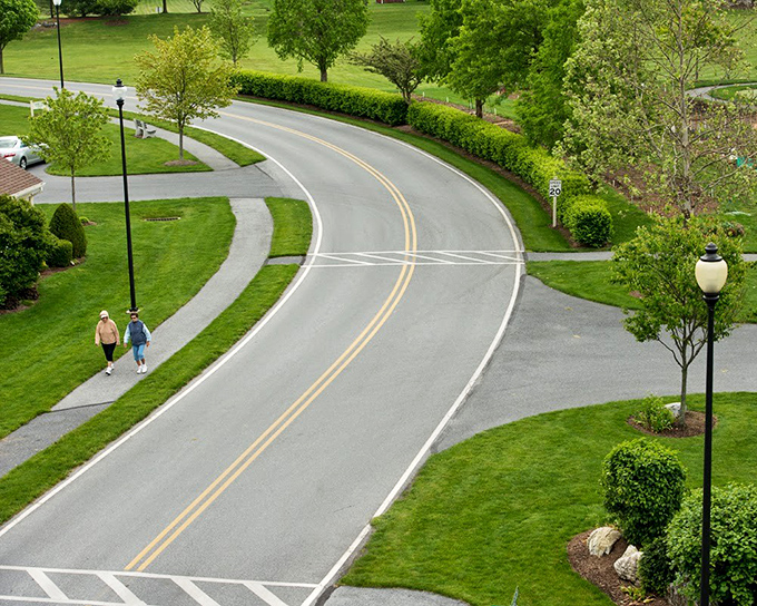 The main campus road curves through the property like an invitation, not just a way to get from A to B.