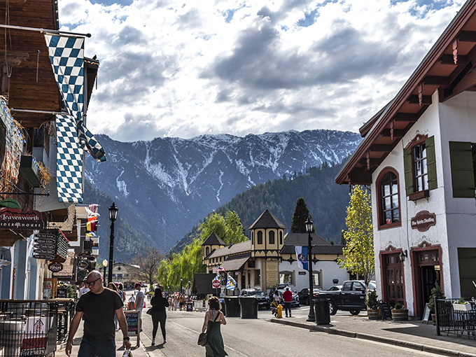 Blue-and-white Bavarian flags flutter against mountain backdrops on Front Street, where every building seems to be auditioning for a European travel brochure.