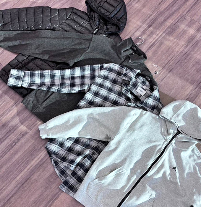 The layering trifecta: puffer jacket, flannel, and hoodie. Perfect for Missouri's "four seasons in one day" weather patterns.