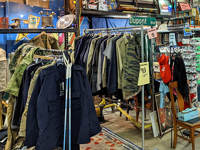Military surplus meets vintage fashion in this corner where DuPont Blvd street signs hang above jackets that have stories sewn into every seam.