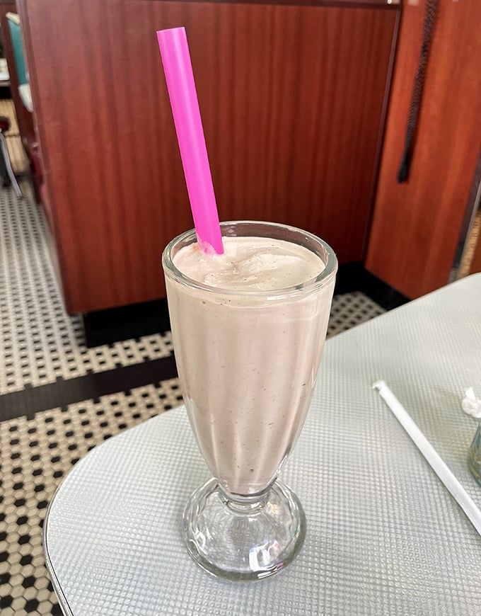 A milkshake so thick the straw stands at attention &ndash; this isn't just dessert, it's an engineering marvel with a pink straw crown.