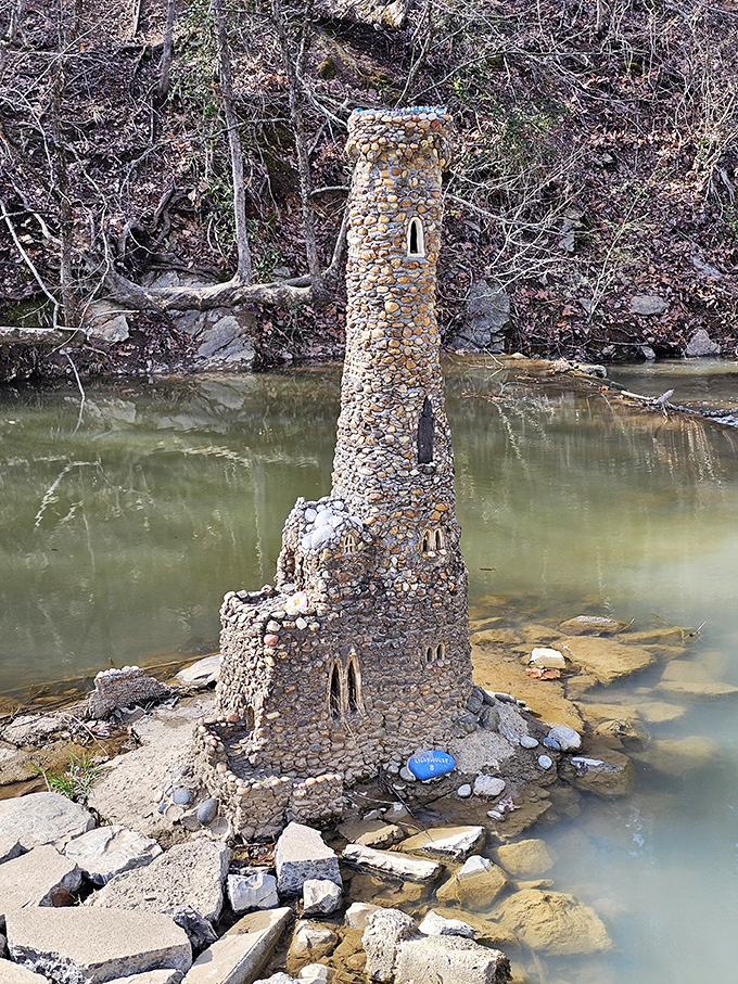 This lonely tower stands sentinel over a peaceful pond, like something straight out of a fantasy novel where the hero is about to embark on an epic quest.