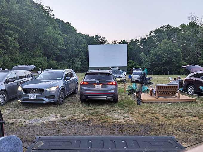 The perfect movie setup: SUVs, a wooden deck, and the great outdoors. Some viewers create living rooms under the stars.