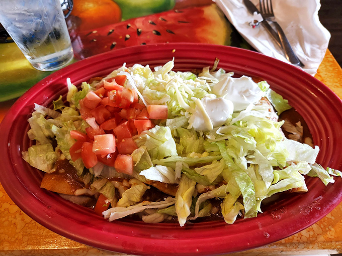A mountain of nachos that demands to be conquered one crunchy, cheese-laden bite at a time.
