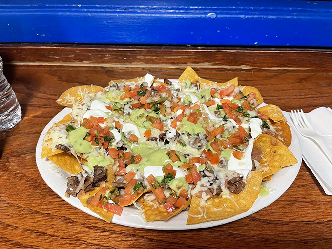 Those nachos aren't messing around&mdash;loaded with the kind of generous toppings that make sharing a moral dilemma.