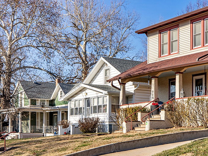 Charming front porches line residential streets, each one a potential setting for neighborly conversations and impromptu gatherings that define small-town living.