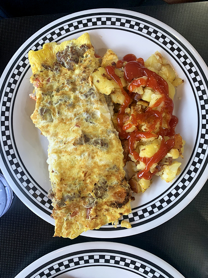 This isn't just an omelet&mdash;it's an architectural achievement of egg engineering, with enough fillings to qualify as apartment living for your fork.