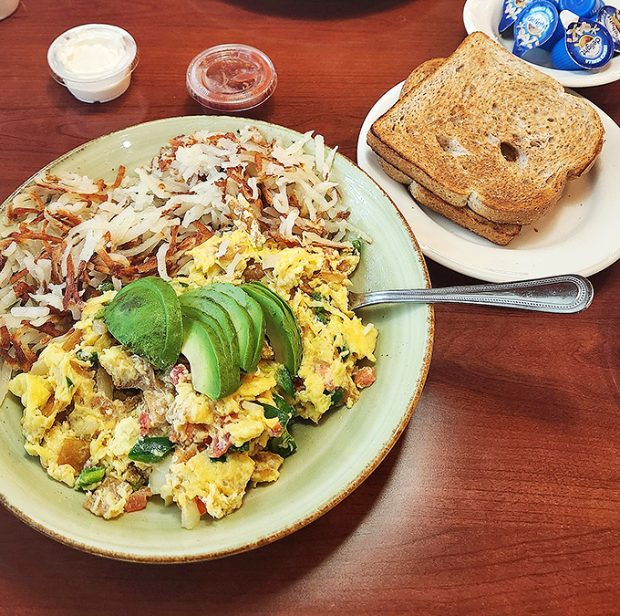 This isn't just breakfast, it's art &ndash; scrambled eggs nestled against crispy hash browns with avocado adding that California cameo.