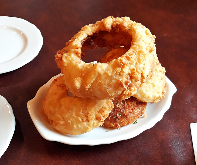 These aren't just onion rings&mdash;they're golden halos of happiness that shatter with a satisfying crunch before melting into sweet onion bliss. 