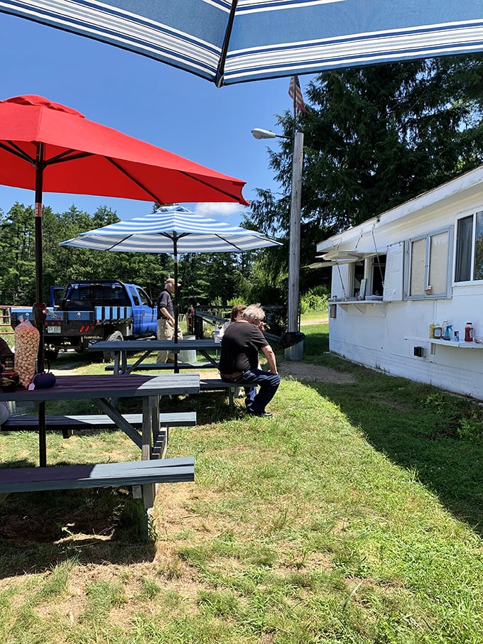 Picnic tables with umbrellas offer shaded spots to rest weary treasure-hunting feet and contemplate your growing cart.