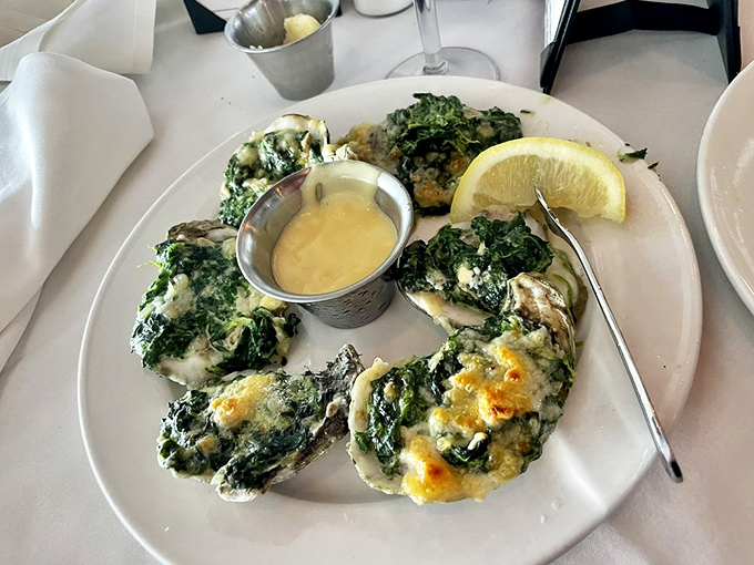 Oysters Rockefeller dressed in their Sunday best—creamed spinach and Parmesan creating a luxurious blanket that would make even the pickiest eater swoon.