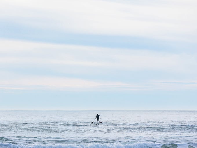 Solitude on a paddle board—where the horizon becomes your meditation point and office stress dissolves faster than sugar in hot coffee.