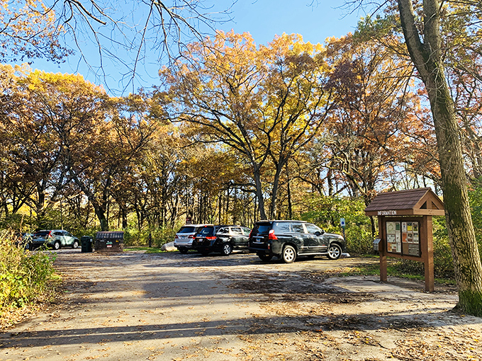 Fall's fiery palette frames the parking area, nature's way of saying "Welcome!" Proof that even mundane beginnings can lead to extraordinary adventures.