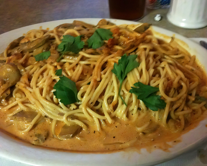 Pasta that doesn't care about your beach plans tomorrow. This creamy, herb-flecked spaghetti is what comfort looks like after being translated into carbohydrates.