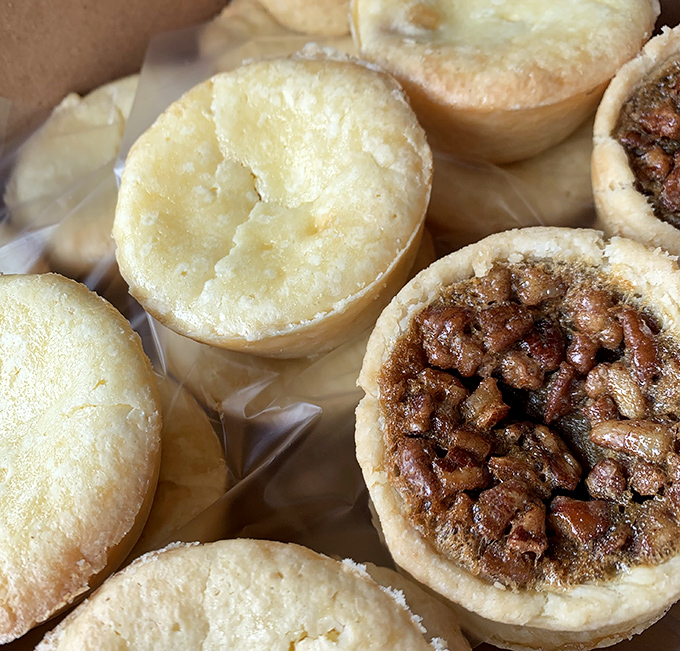 Tiny pecan tarts with big flavor ambitions. Half shortbread cookie, half pecan pie, all delicious &ndash; mathematics never tasted so good.