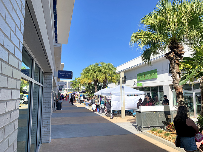 Sun-drenched walkways lined with storefronts invite leisurely strolling. The perfect blend of outdoor Florida living and air-conditioned shopping retreats.