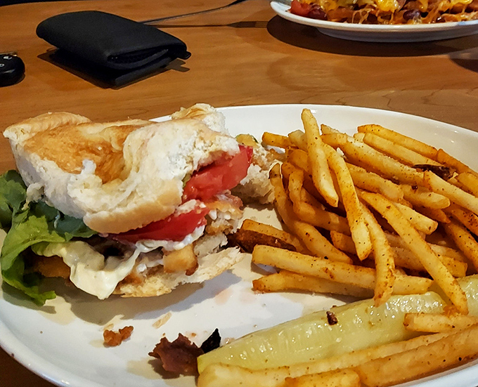 This sandwich isn't just lunch – it's a masterclass in balance with crispy, golden fries that deserve their own fan club.