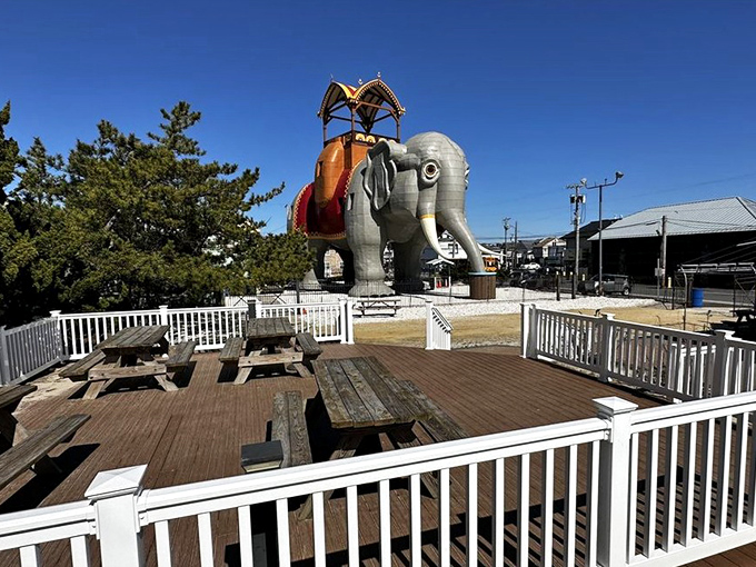 Picnic tables with the ultimate conversation piece looming overhead. "Pass the sandwiches and would you look at that elephant?"