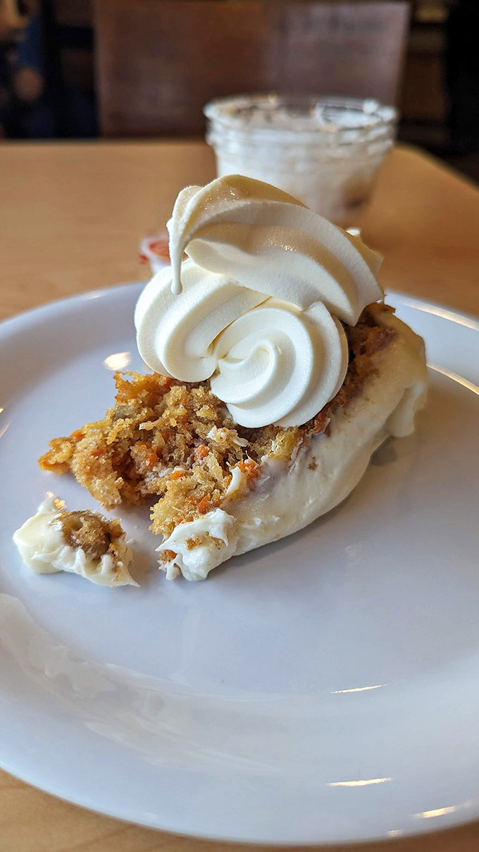 This carrot cake slice topped with swirls of frosting looks like it belongs in a bakery window rather than an all-you-can-eat dessert station.