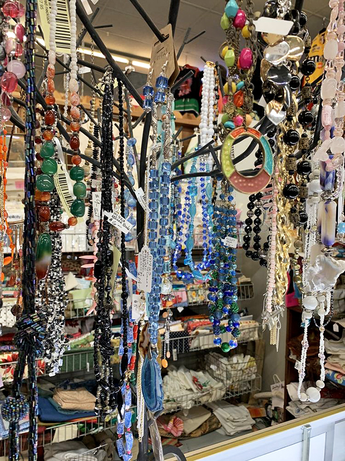 A jewelry lover's dream display&mdash;colorful beads and vintage necklaces cascade like a waterfall of wearable history.