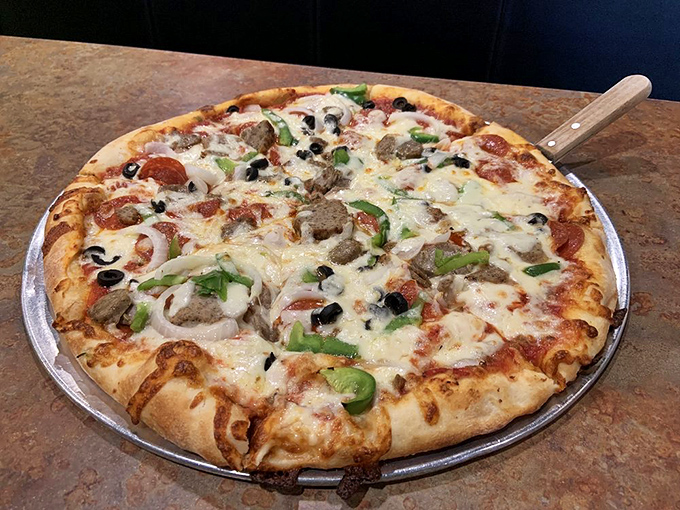 The "everything" pizza showcases the kitchen's restraint—loaded with toppings but still maintaining structural integrity. Engineering meets art.