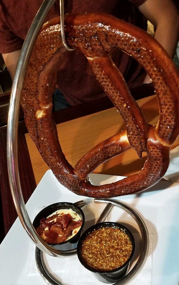 This pretzel defies physics with its size while maintaining that perfect balance of chewy interior and salted exterior that makes Bavarians weep joyfully.