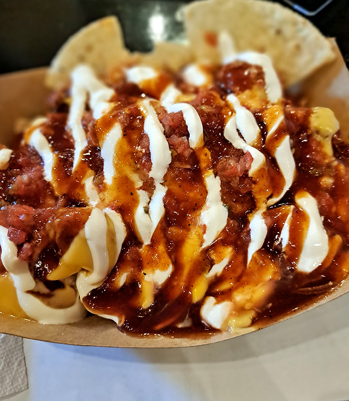 When nachos meet pulled chicken, it's not just a meal—it's a masterclass in how cheese, meat, and sauce can achieve harmony.