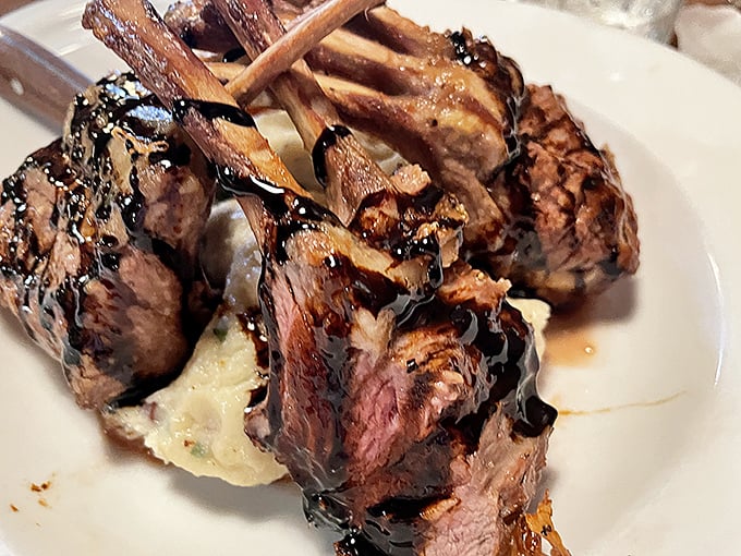 Rack of lamb drizzled with reduction so glossy you could check your reflection&mdash;meat lollipops for grown-ups with sophisticated palates.