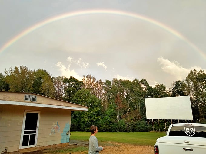 Nature adds its own special effects with a perfect rainbow arching over the screen.