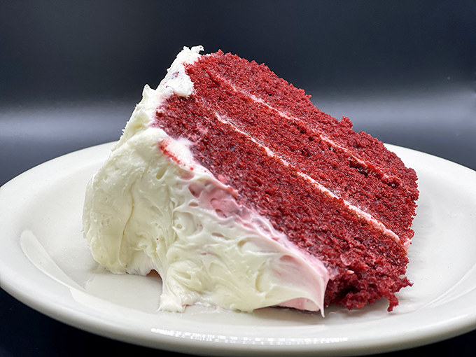Red velvet cake so moist and decadent it deserves its own zip code. The cream cheese frosting alone is worth crossing state lines for.