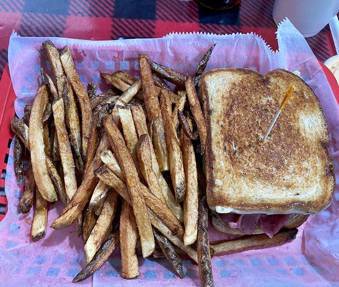 A proper grilled sandwich with golden-brown bread and a mountain of hand-cut fries &ndash; comfort food that speaks the universal language of "mmmmm."