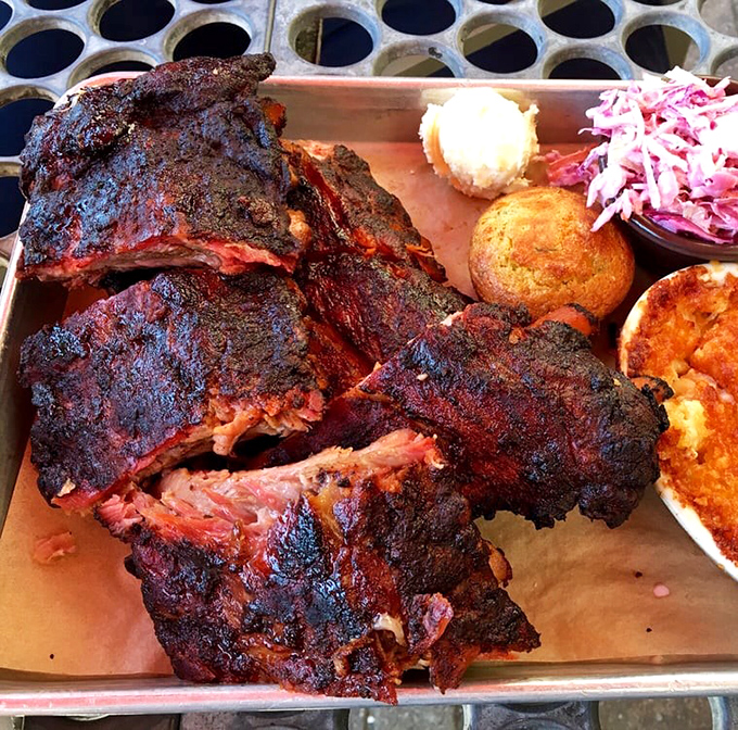 Behold the bark! These ribs wear their smoke ring like a badge of honor, their crust so perfect it should be in a barbecue museum.