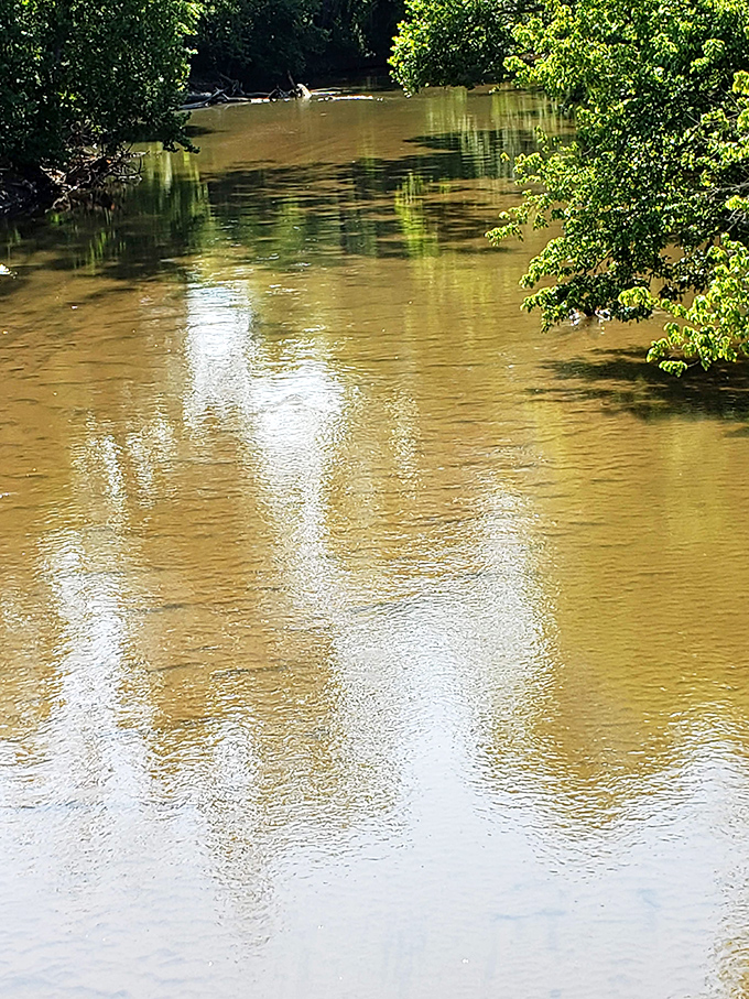 Big Raccoon Creek flows underneath, looking exactly like the kind of water Norman Rockwell would've painted.