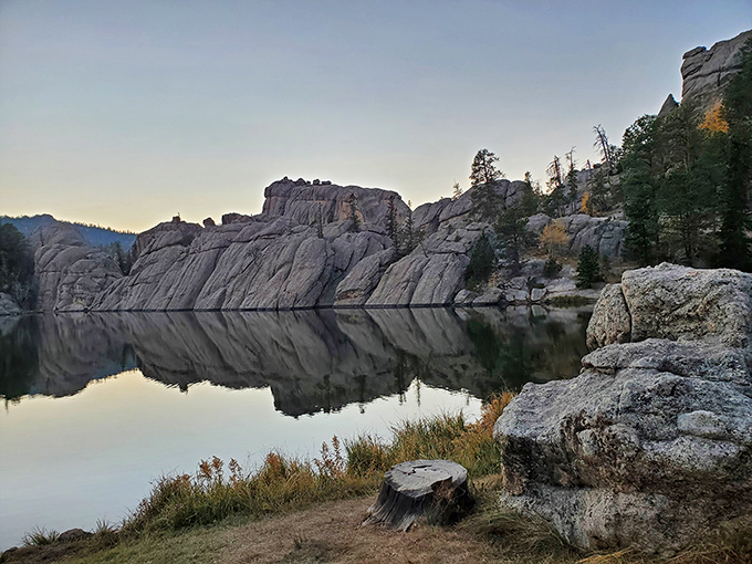 Sylvan Lake's mirror-like surface creates perfect reflections that would make even the most dedicated selfie-taker put down their phone in awe.