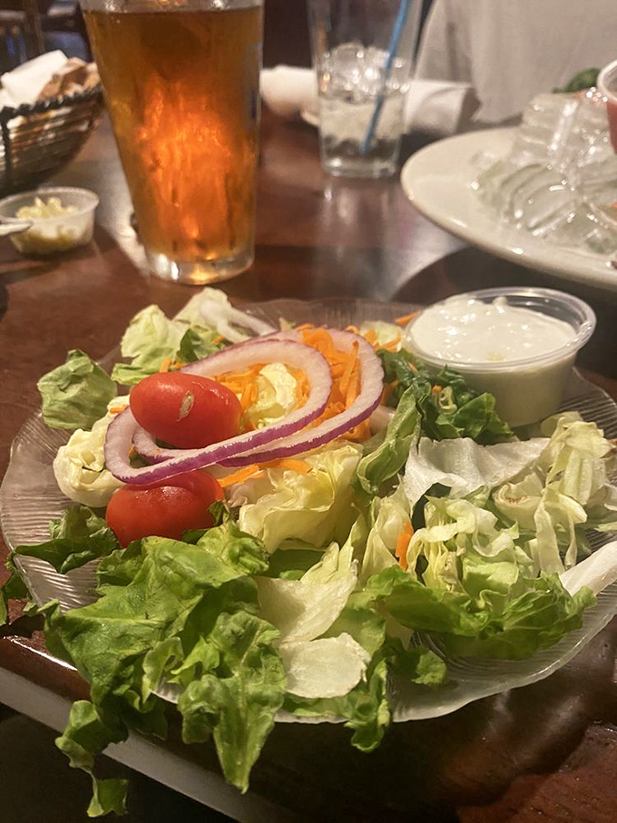 Even their house salad refuses to be ordinary, with those perfectly crisp greens and vibrant tomatoes staging a colorful rebellion against boring rabbit food.