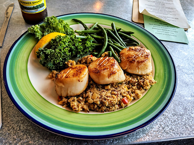 Perfectly seared scallops sit atop a bed that makes them look like edible jewelry you'll actually want to devour immediately.