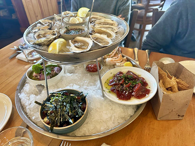 The seafood tower – ocean's greatest hits album on ice. Oysters, clams, and all manner of treasures arranged like Neptune's own centerpiece.