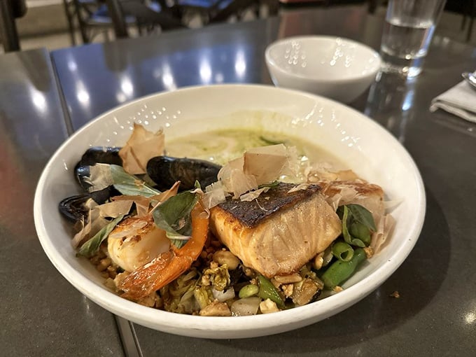 This seafood medley is like an underwater family reunion where everyone actually gets along. The fish, shellfish, and garnishes are practically harmonizing.