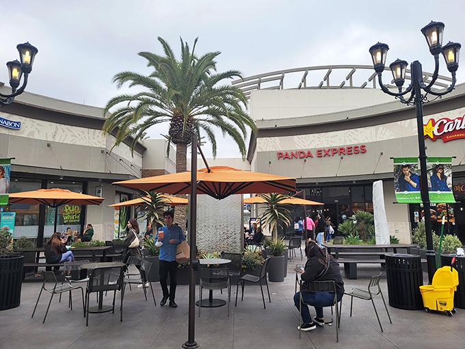 The food court's outdoor seating area &ndash; where shoppers recharge with Panda Express while plotting their next retail conquest.