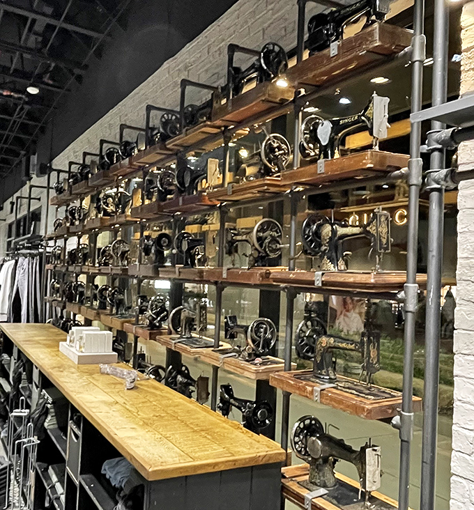 Vintage sewing machines line industrial-chic shelving, merging fashion history with modern shopping in unexpected harmony.