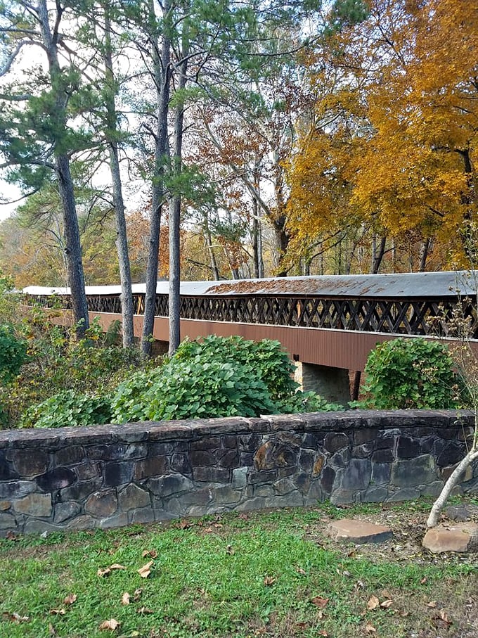 The bridge's rustic silhouette against autumn foliage creates a scene straight out of a Norman Rockwell painting&mdash;minus the subscription to the Saturday Evening Post.