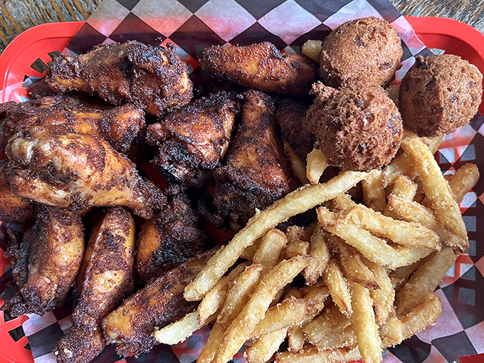 These wings and hush puppies aren't just food; they're edible proof that patience and smoke create culinary magic.