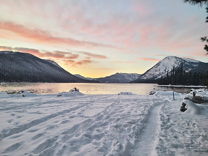 Winter's canvas painted in pastels. Lake Wenatchee's snow-covered shores at sunset remind us why Washington's cold season deserves as much love as its summers.