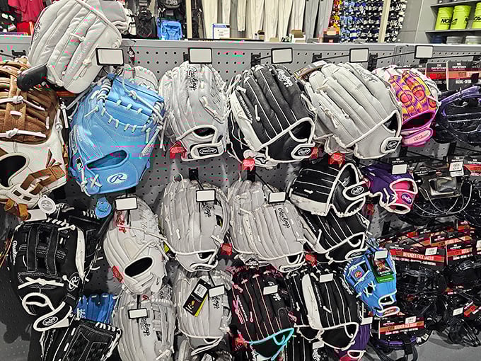 Baseball gloves waiting patiently for someone to revive their Little League glory days, despite creaky knees protesting otherwise.