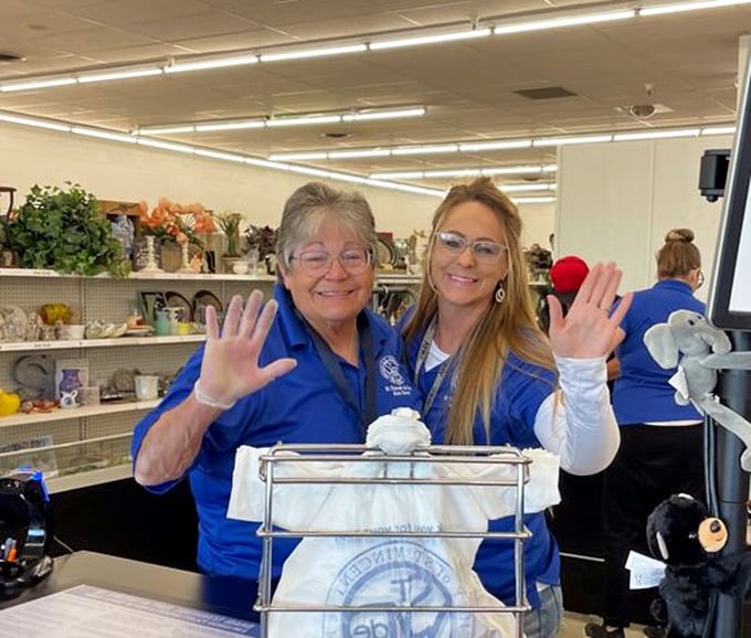 The heart and soul of thrift store magic&mdash;friendly faces who connect communities through recycled treasures. Their smiles are as genuine as the bargains.