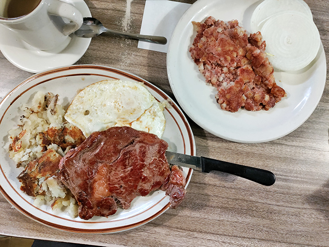 A plate that answers the eternal question: "What does morning victory look like?" Perfectly cooked steak, sunny eggs, and hash browns that didn't come from a freezer.